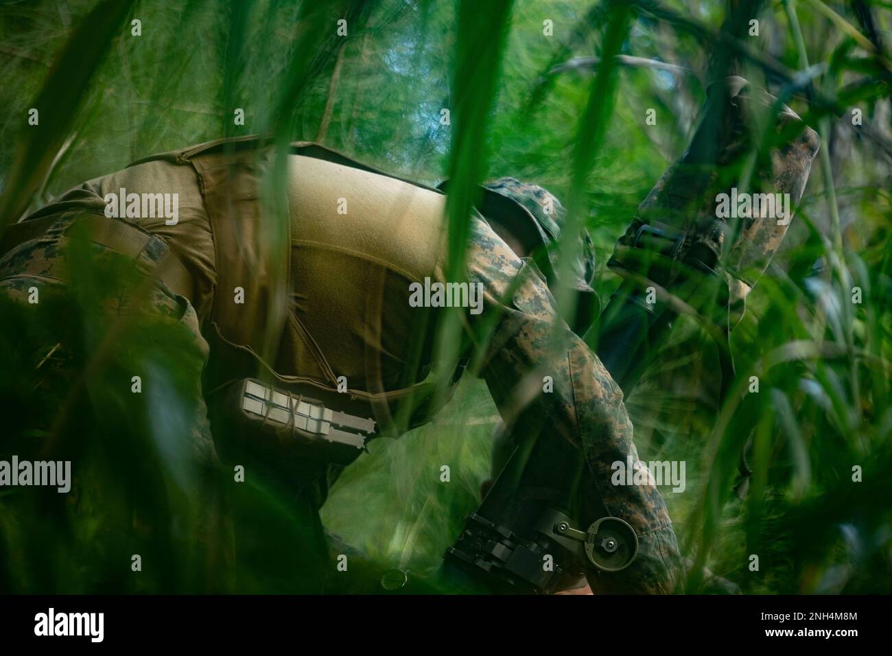 A U.S. Marine with 3d Battalion, 4th Marines sets up a mortar position ...