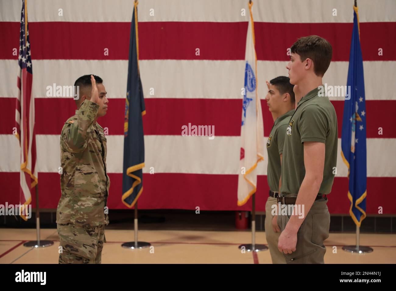 The oath of enlistment is administered to two of the New York Army ...