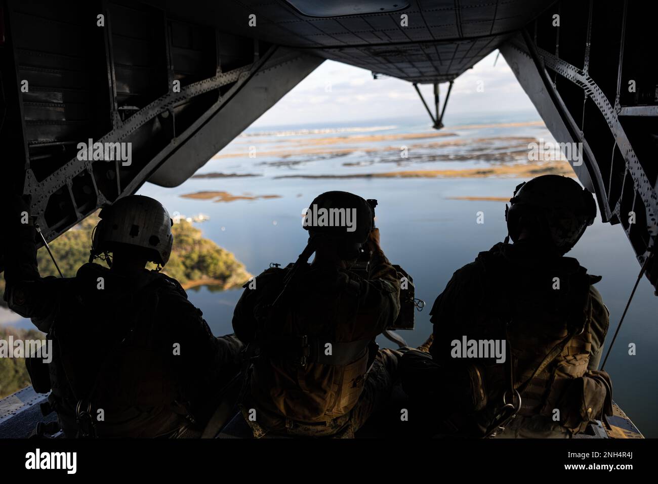 U.S. Marines assigned to the 26th Marine Expeditionary Unit look out ...