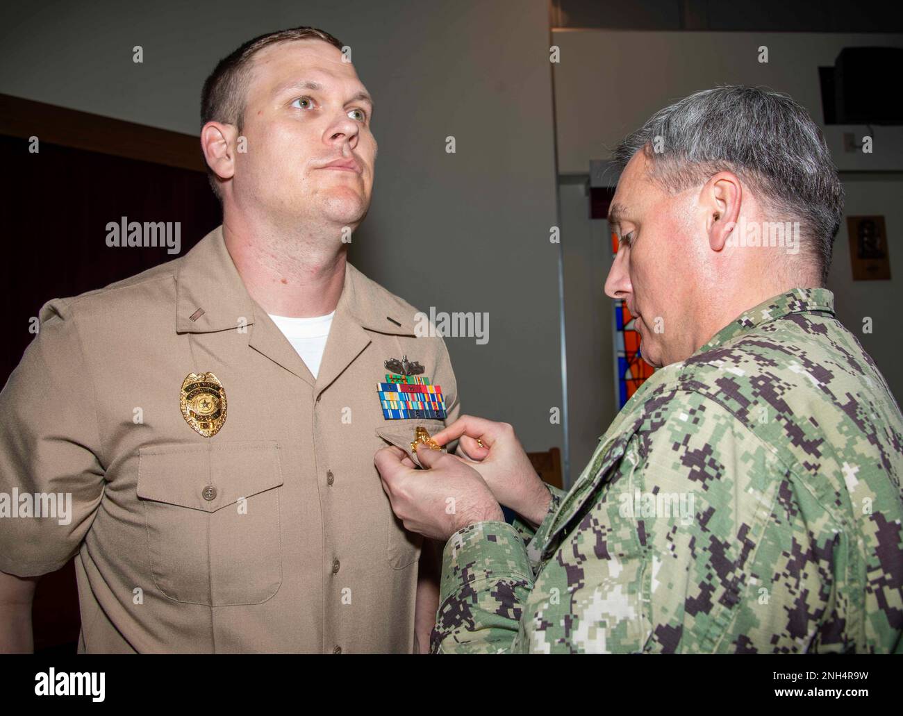 Cmdr. Douglas Kennedy, chief staff officer of Commander, Fleet Activities Sasebo (CFAS), pins Lt ...
