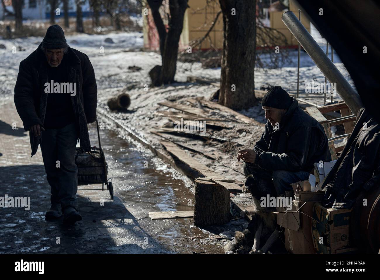 Local residents are seen in the street in Bakhmut, Donetsk region ...
