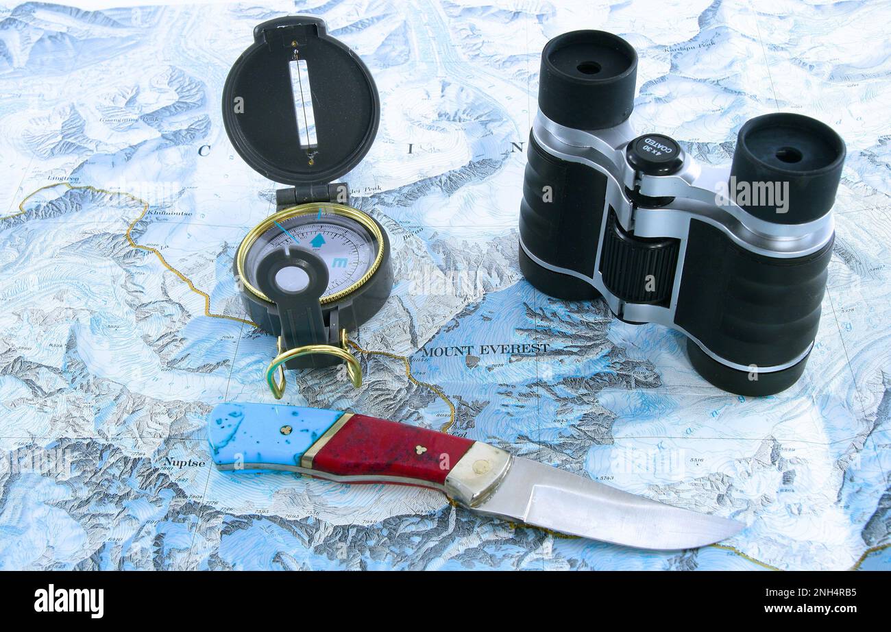 compass knife and binocular on map Stock Photo - Alamy