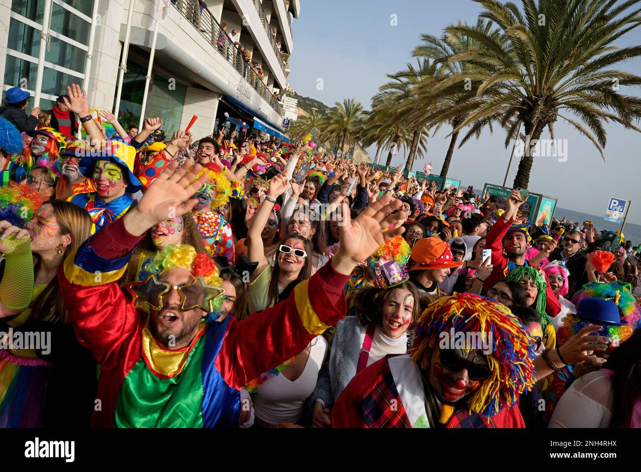 Revelers dance during the Clowns Parade in Sesimbra, Portugal, Monday ...