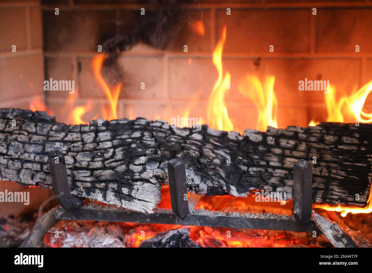 wood burning fire and smoke around bonfire fireplace with flames Stock ...