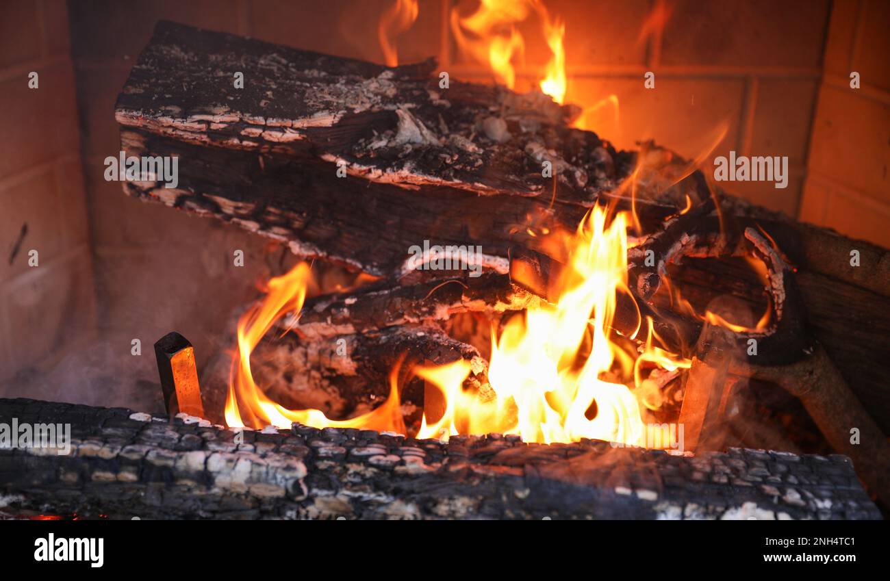 wood burning fire and smoke around bonfire fireplace with flames Stock ...