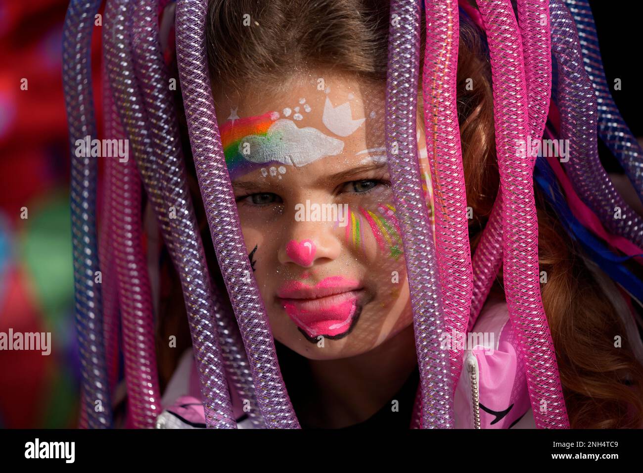 A child looks attends the Clowns Parade in Sesimbra, Portugal, Monday ...