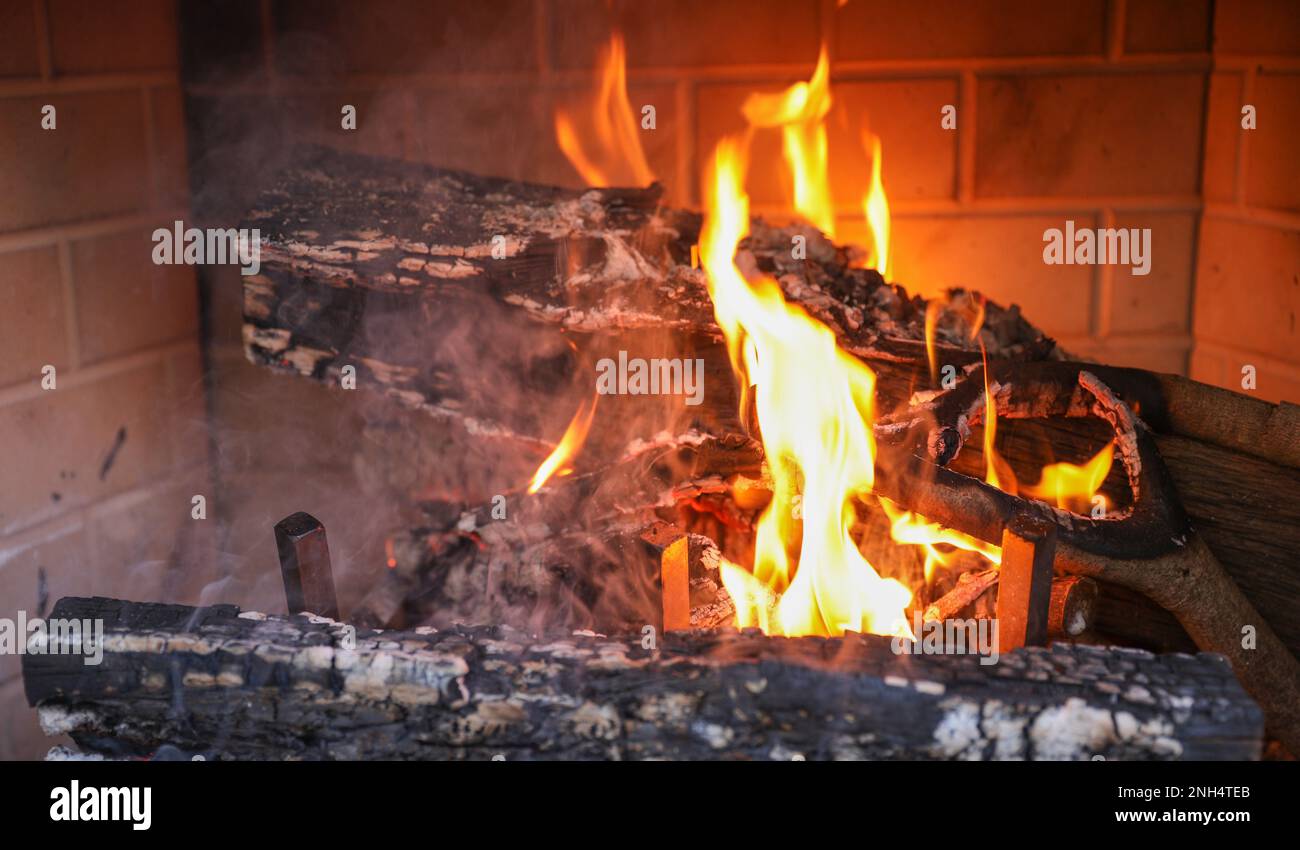 wood burning fire and smoke around bonfire fireplace with flames Stock ...