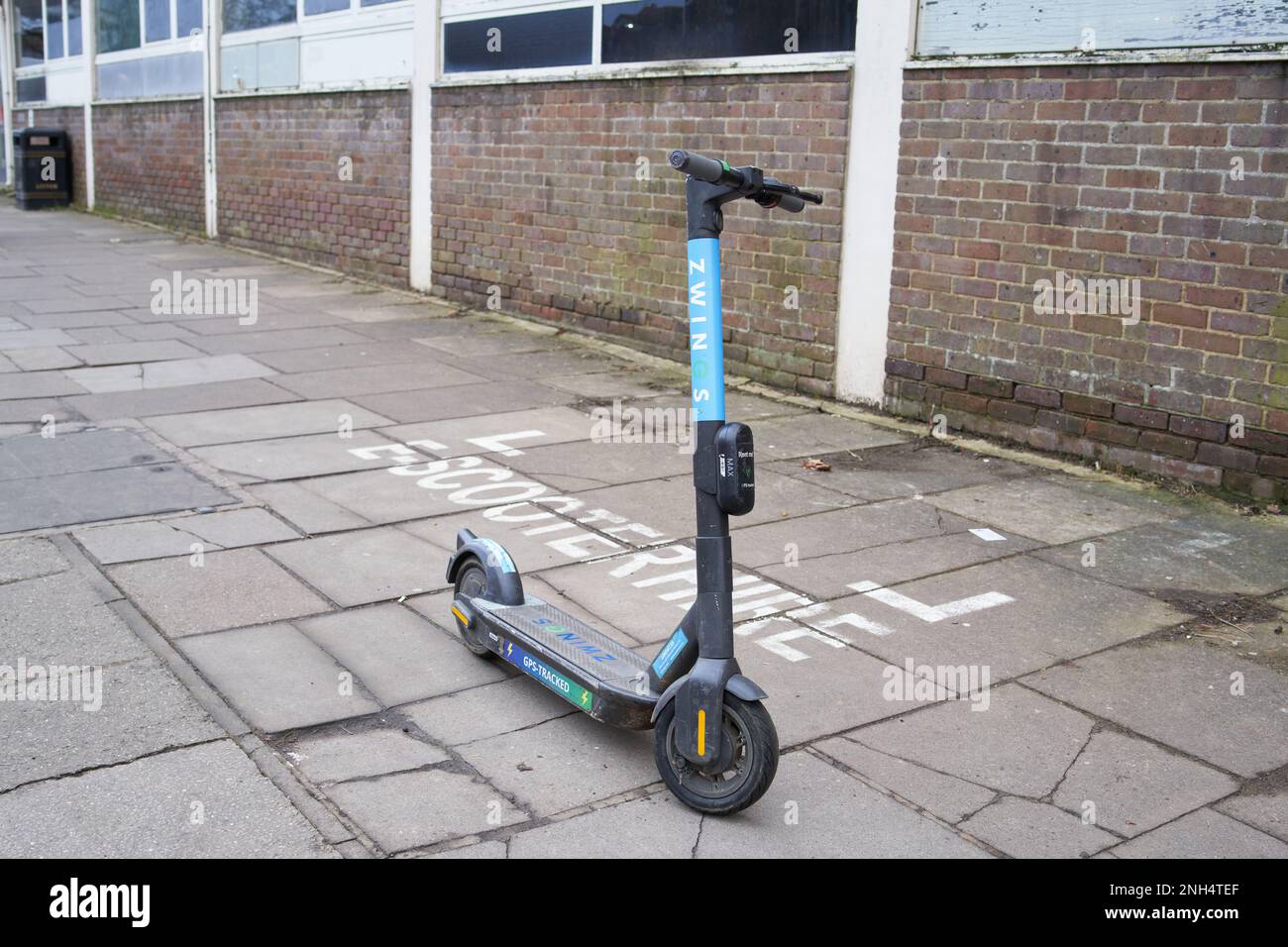 Electric Scooter outside a parking bay Stock Photo - Alamy