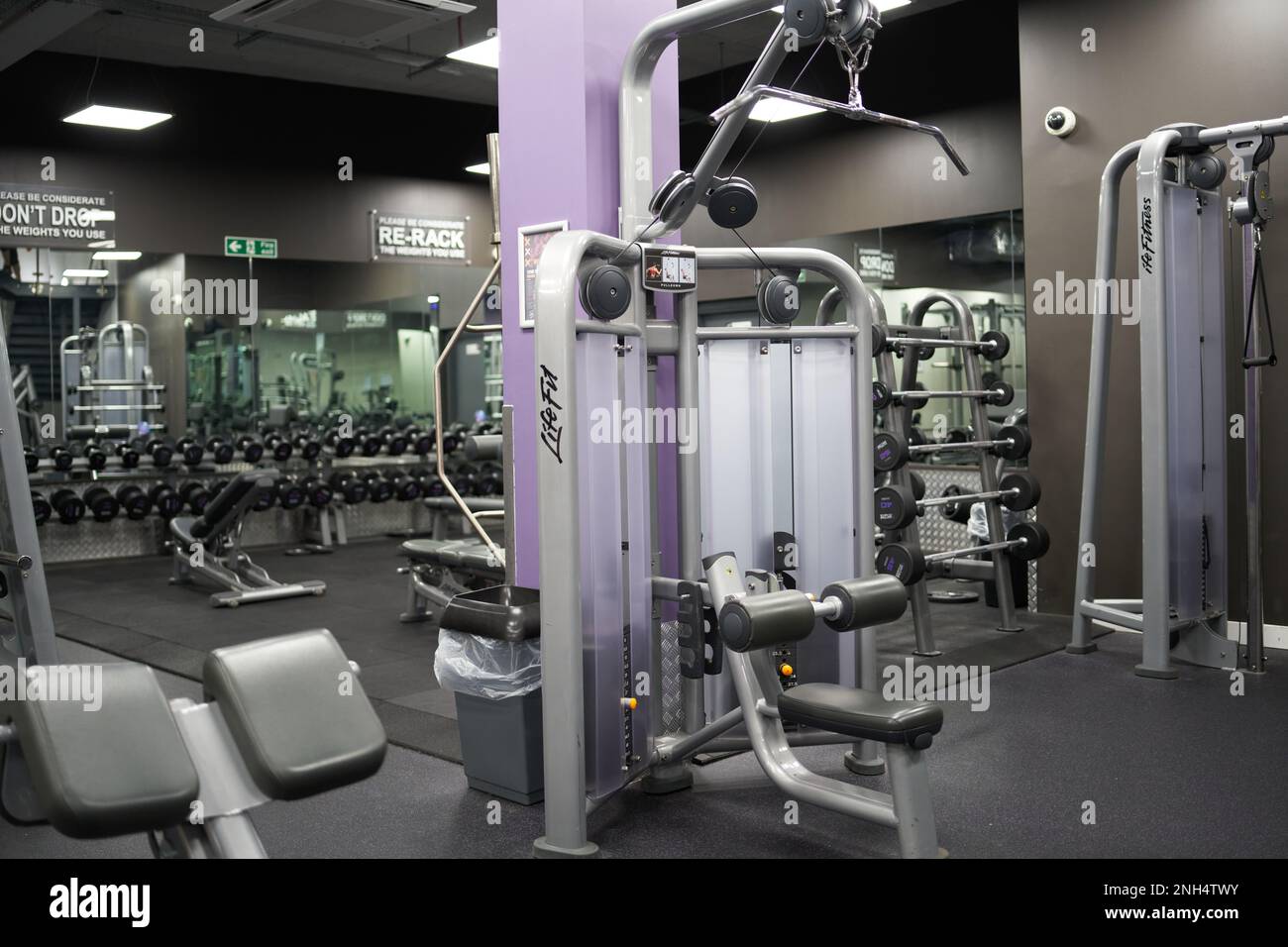 Inside images of a gym with no people and various bits of equipment ...