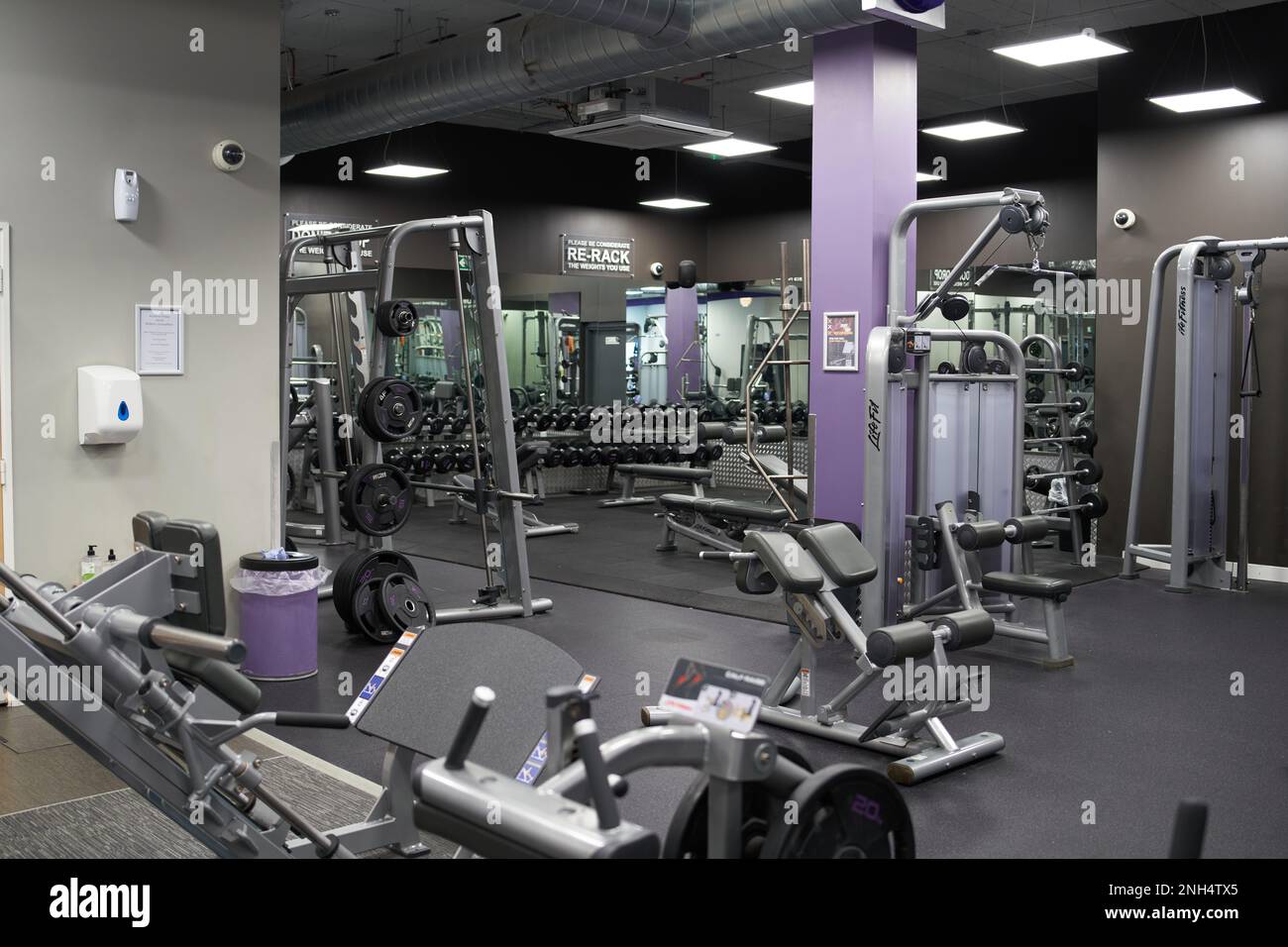 Inside images of a gym with no people and various bits of equipment ...