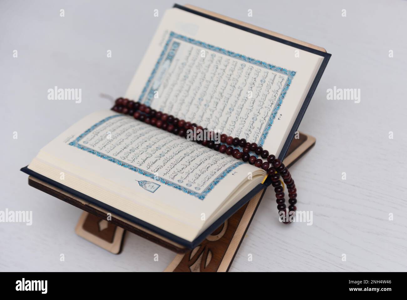 The words on Qoran is arabic words which means the Holy Qoran. Muslim ...