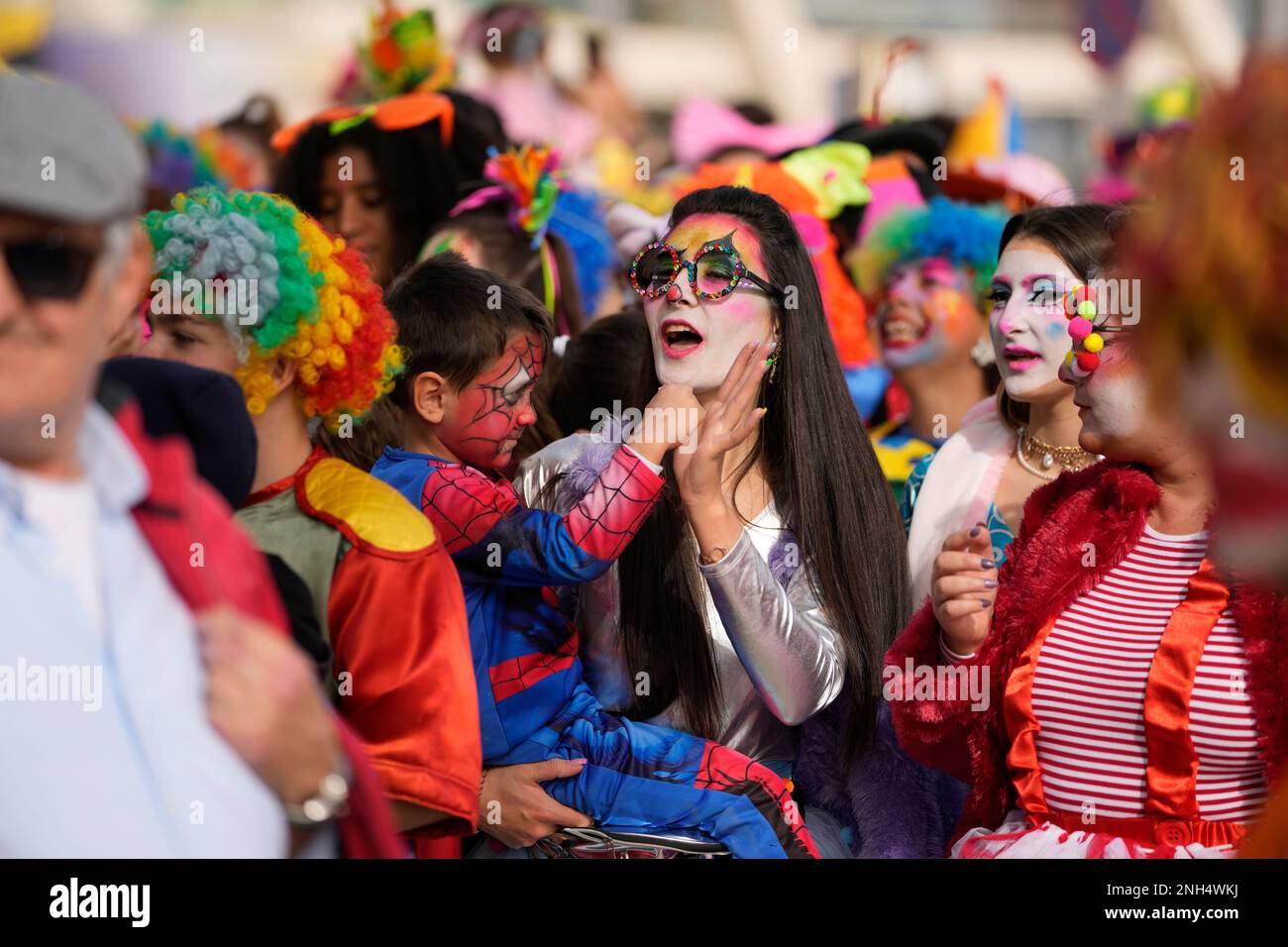 A woman dances with a child during the Clowns Parade in Sesimbra ...