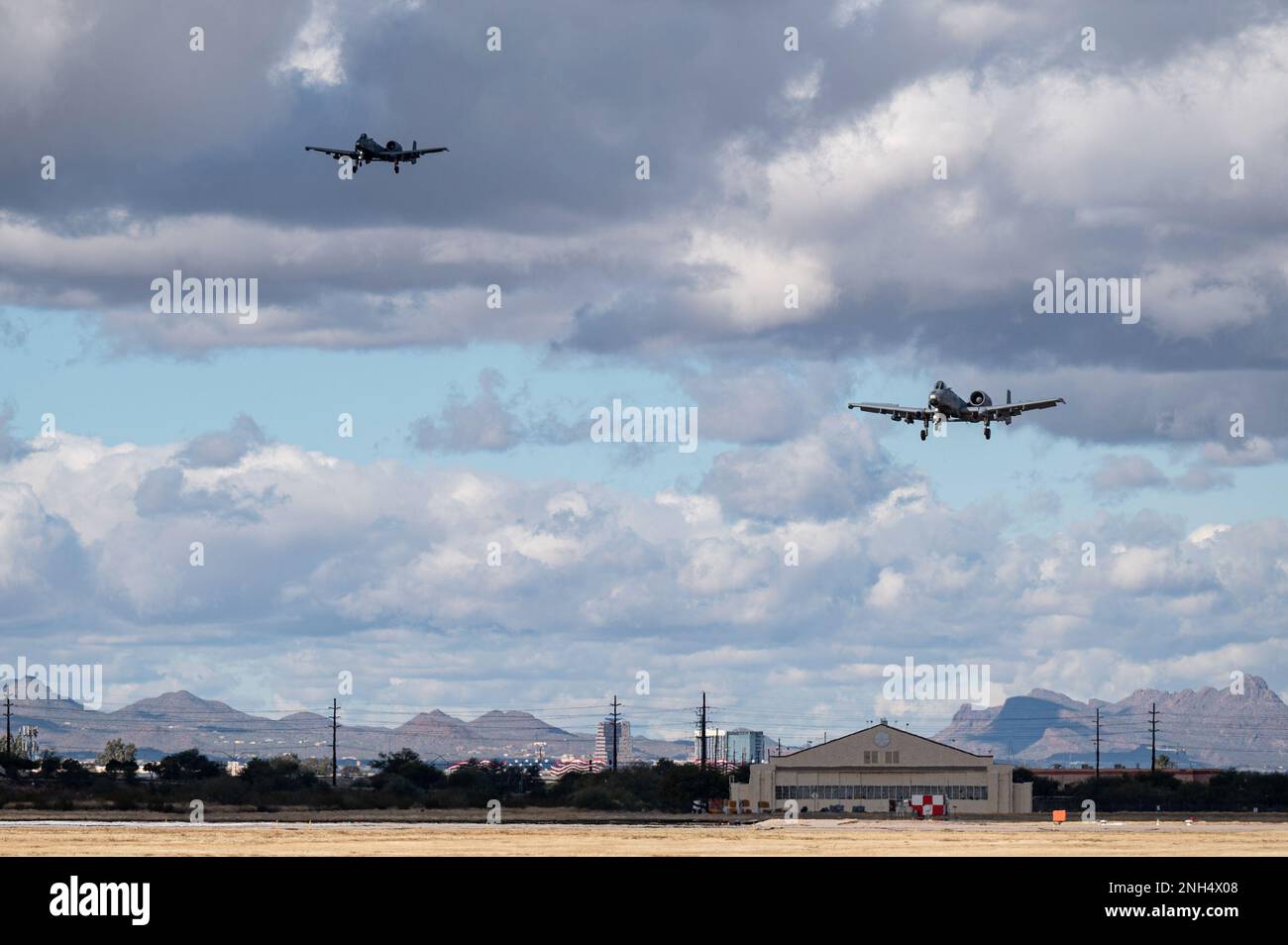 Two A-10 Thunderbolt IIs assigned to the 355th Wing fly over the flight ...