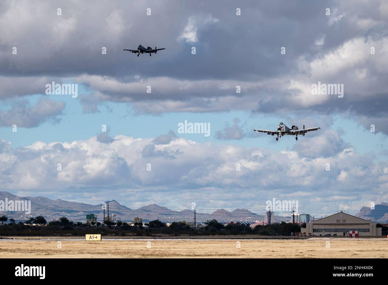 Two A-10 Thunderbolt IIs assigned to the 355th Wing fly over the flight ...