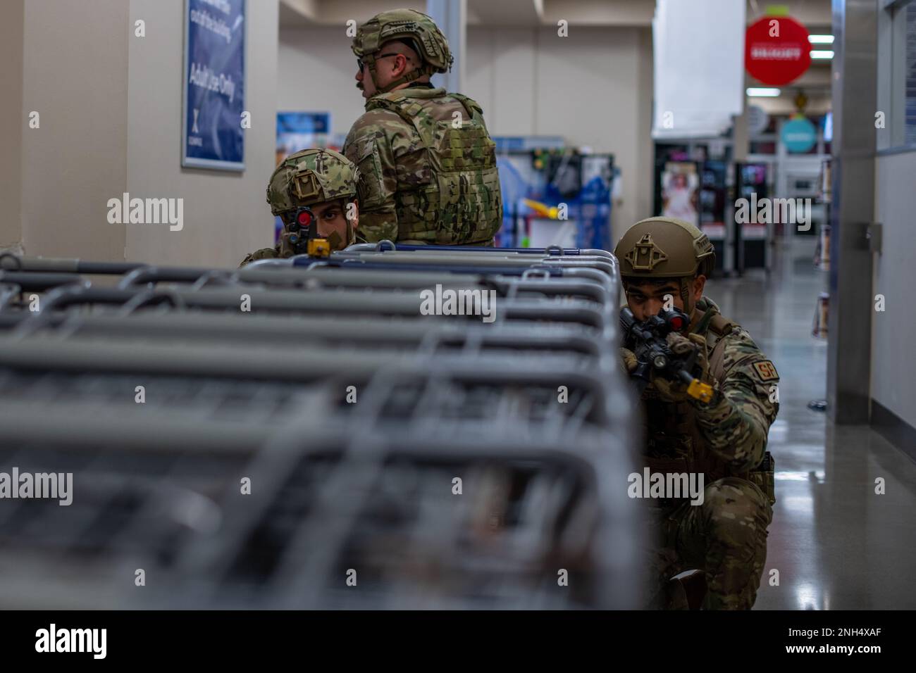 Defenders assigned to the 18th Security Forces Squadron take cover ...