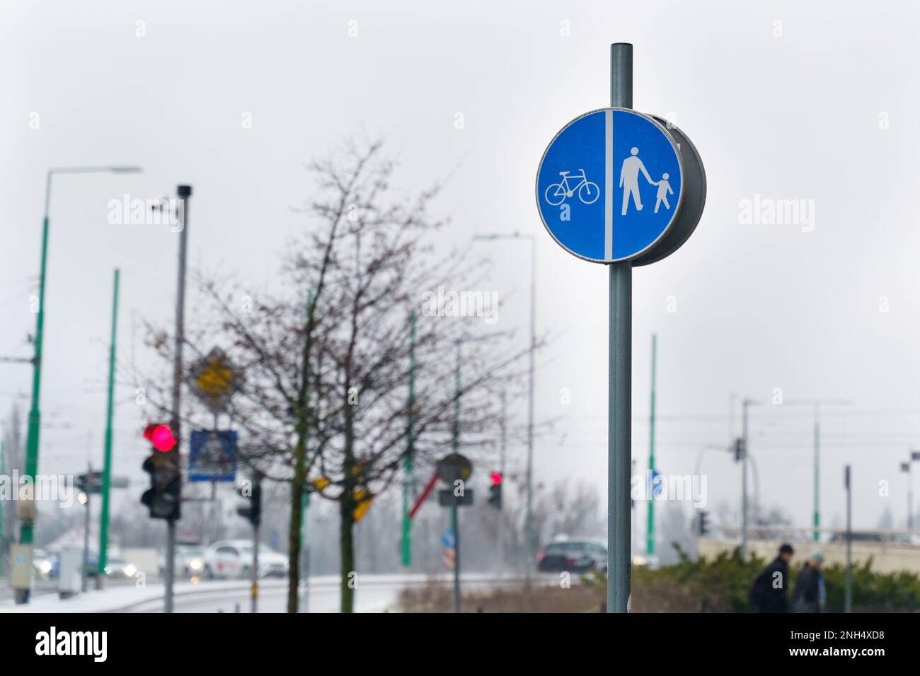 Separation sign for cyclists and pedestrians on a city street. Traffic ...