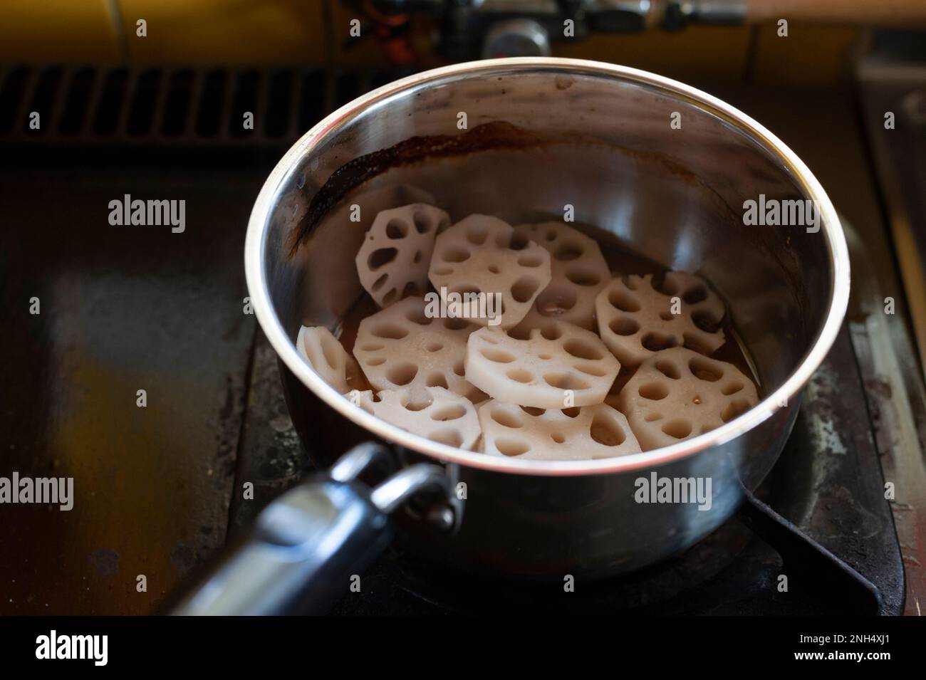 Preparing traditional Japanese vegetables, in this case lotus root, for ...