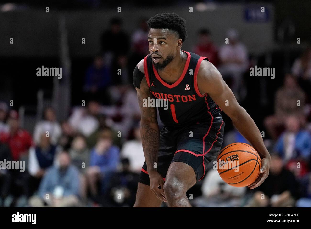Houston guard Jamal Shead advances the ball against SMU during an NCAA ...
