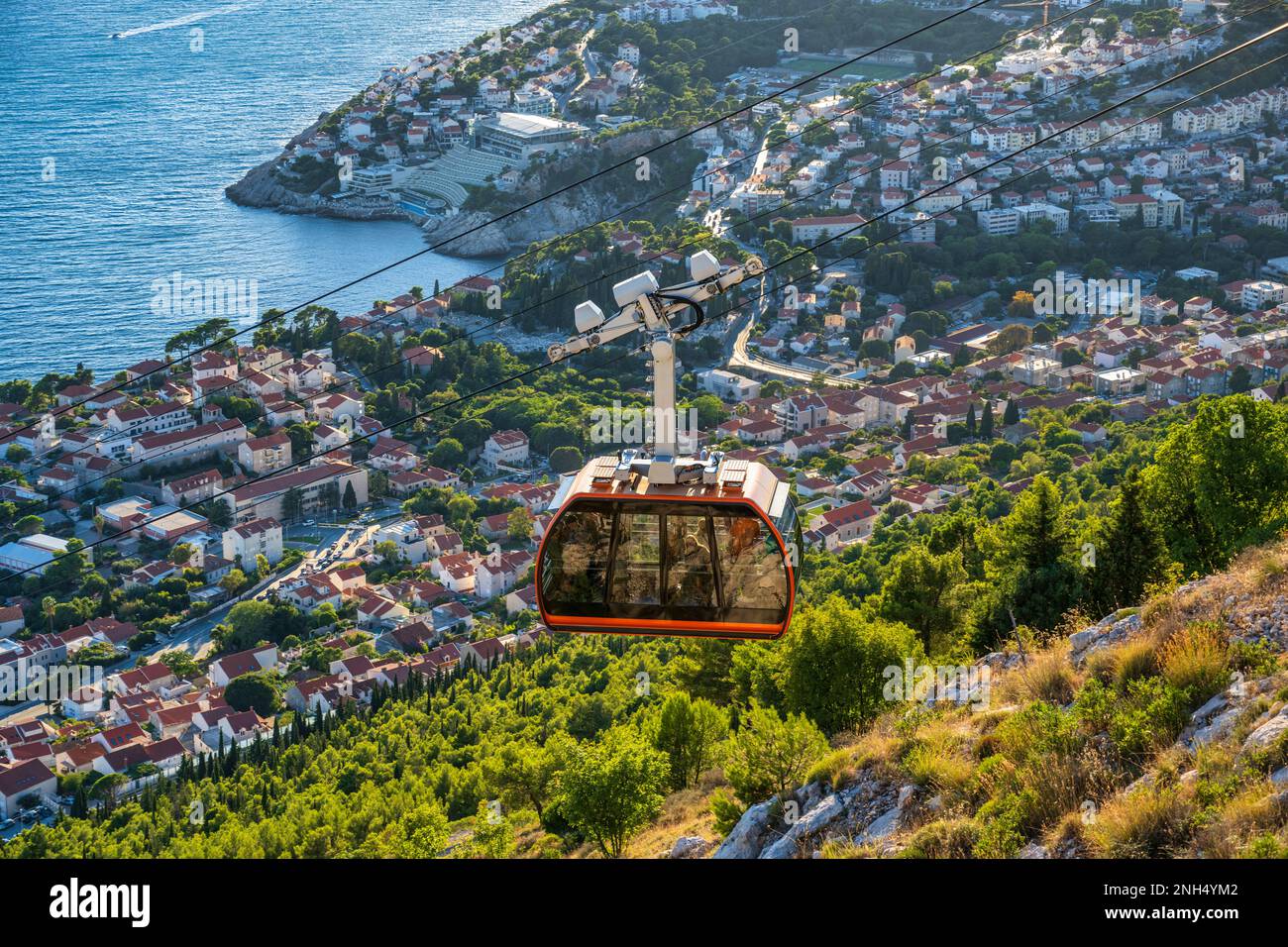 View of Dubrovnik cable car ascending from the old walled town of ...
