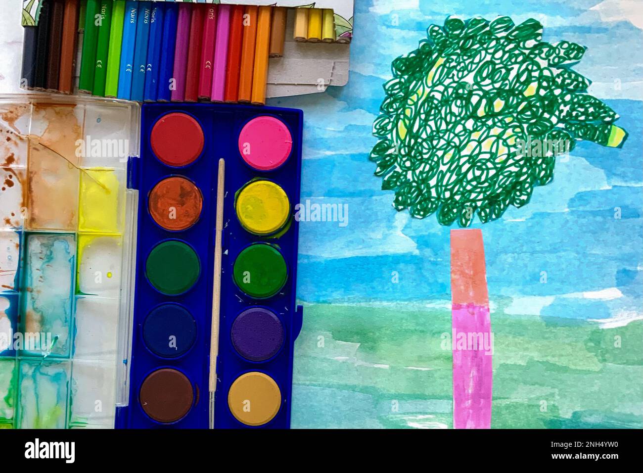 Young girl painting during art class at school Stock Photo - Alamy