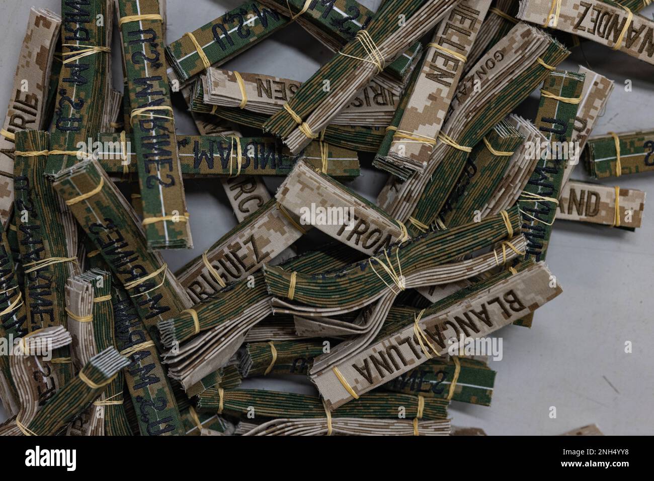 U.S. Marine Corps name tapes are displayed during a uniform fitting at ...