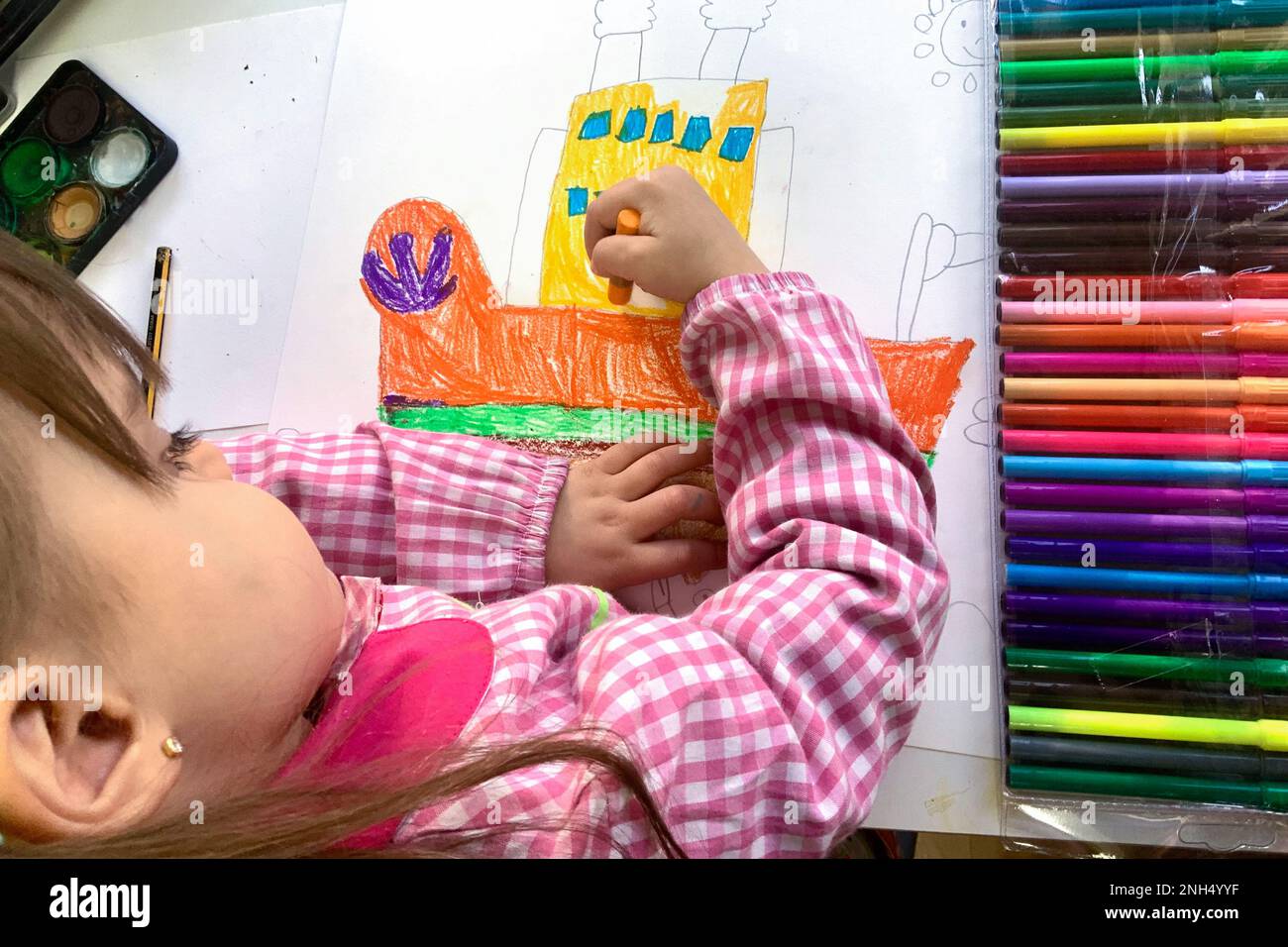 Young girl painting during art class at school Stock Photo - Alamy