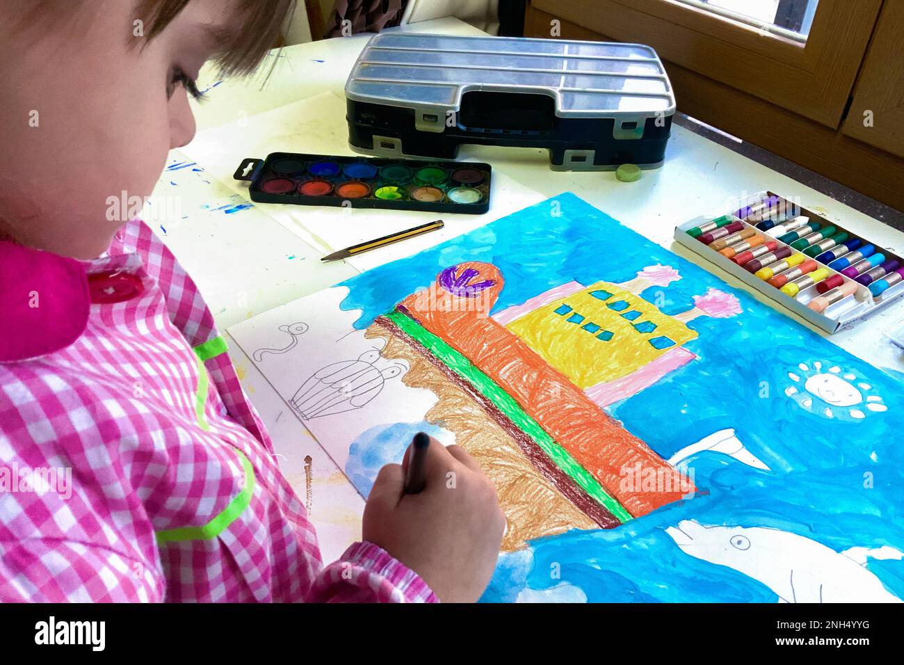 Young girl painting during art class at school Stock Photo - Alamy