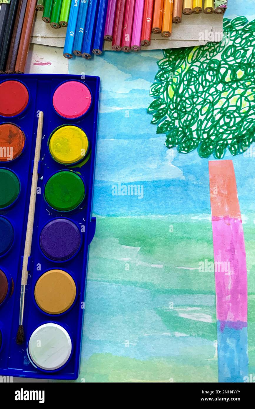 Young girl painting during art class at school Stock Photo - Alamy