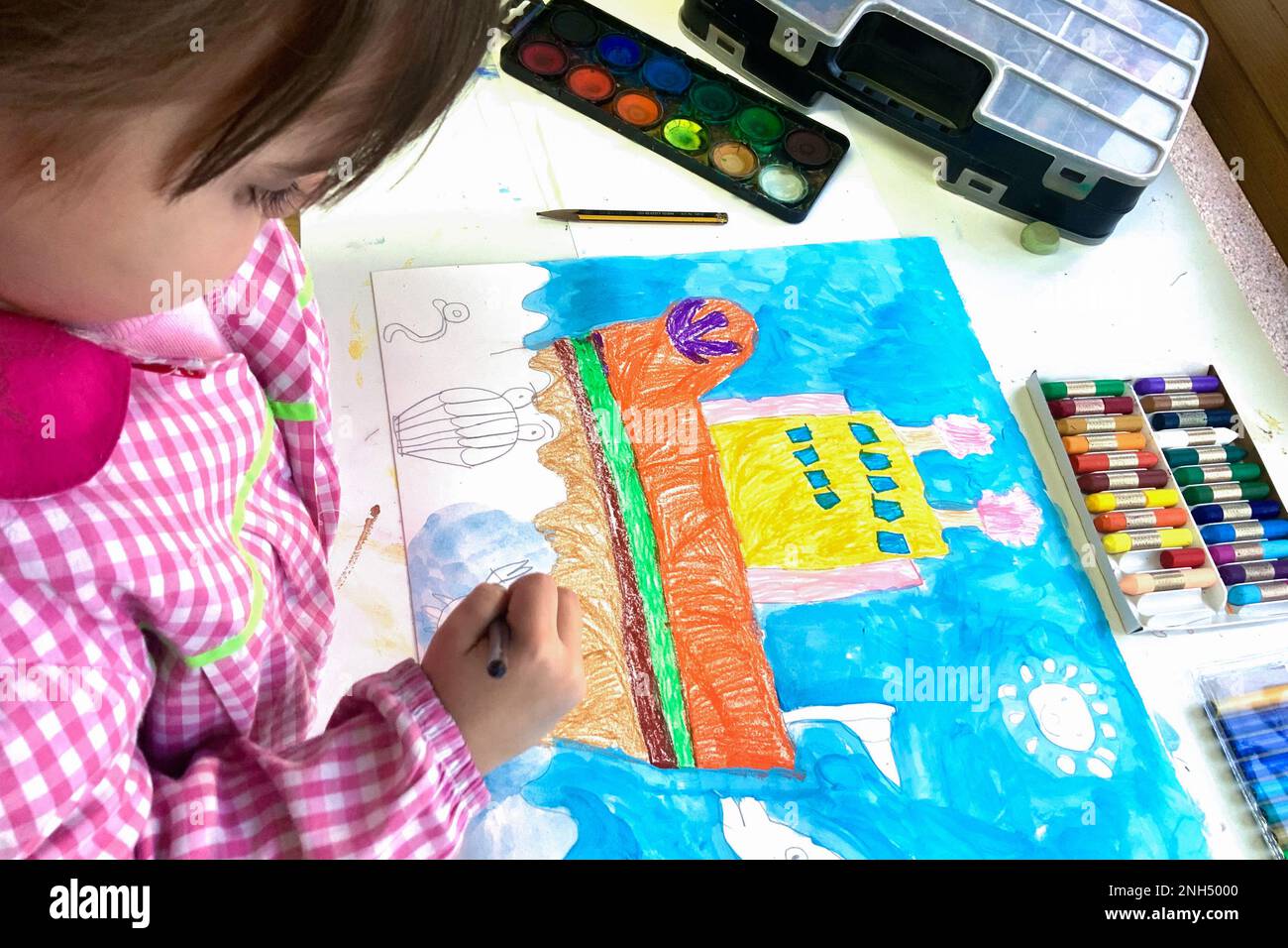 Young girl painting during art class at school Stock Photo - Alamy