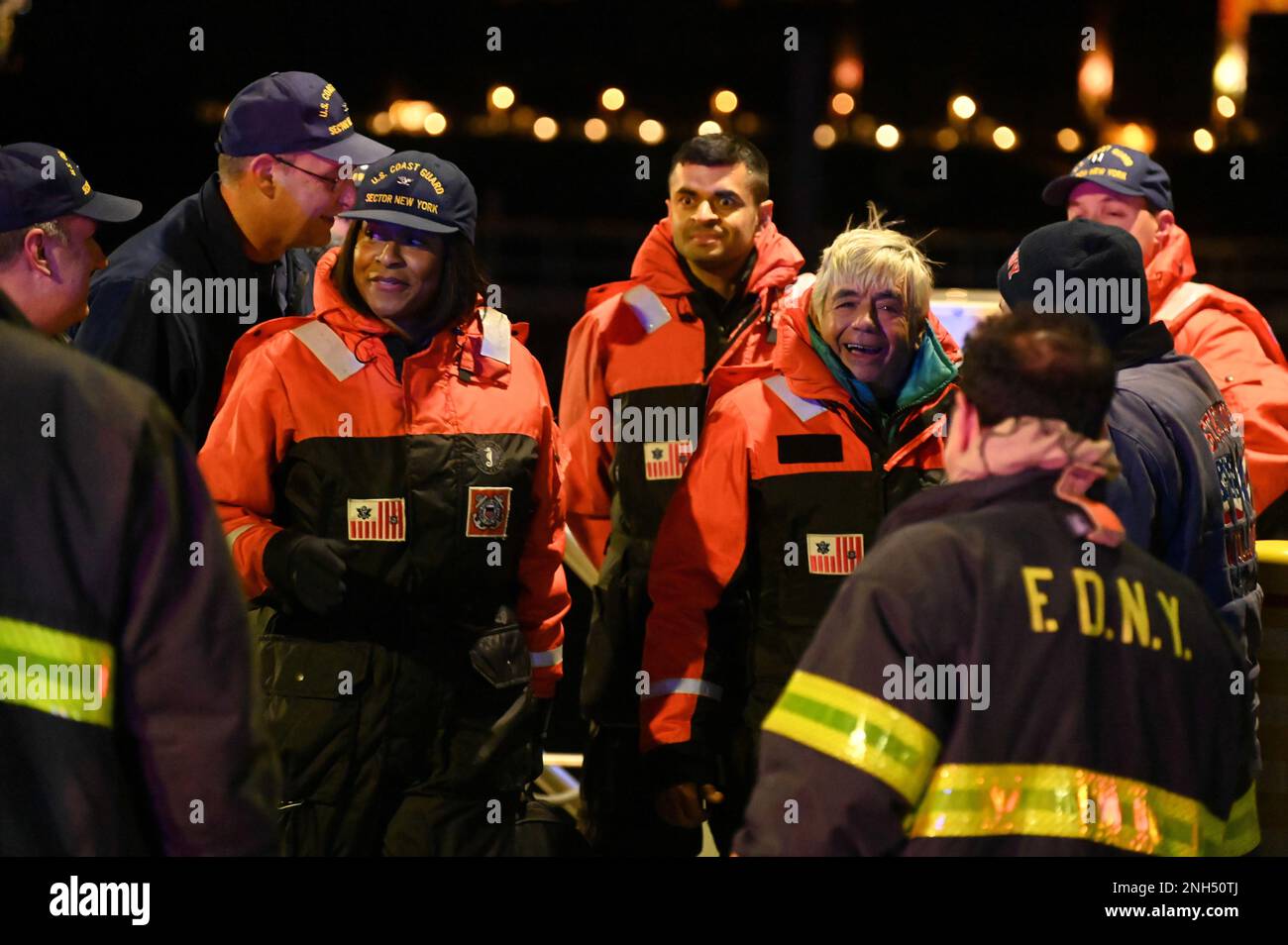 U.S. Coast Guard and FDNY members welcome rescued boaters and their ...