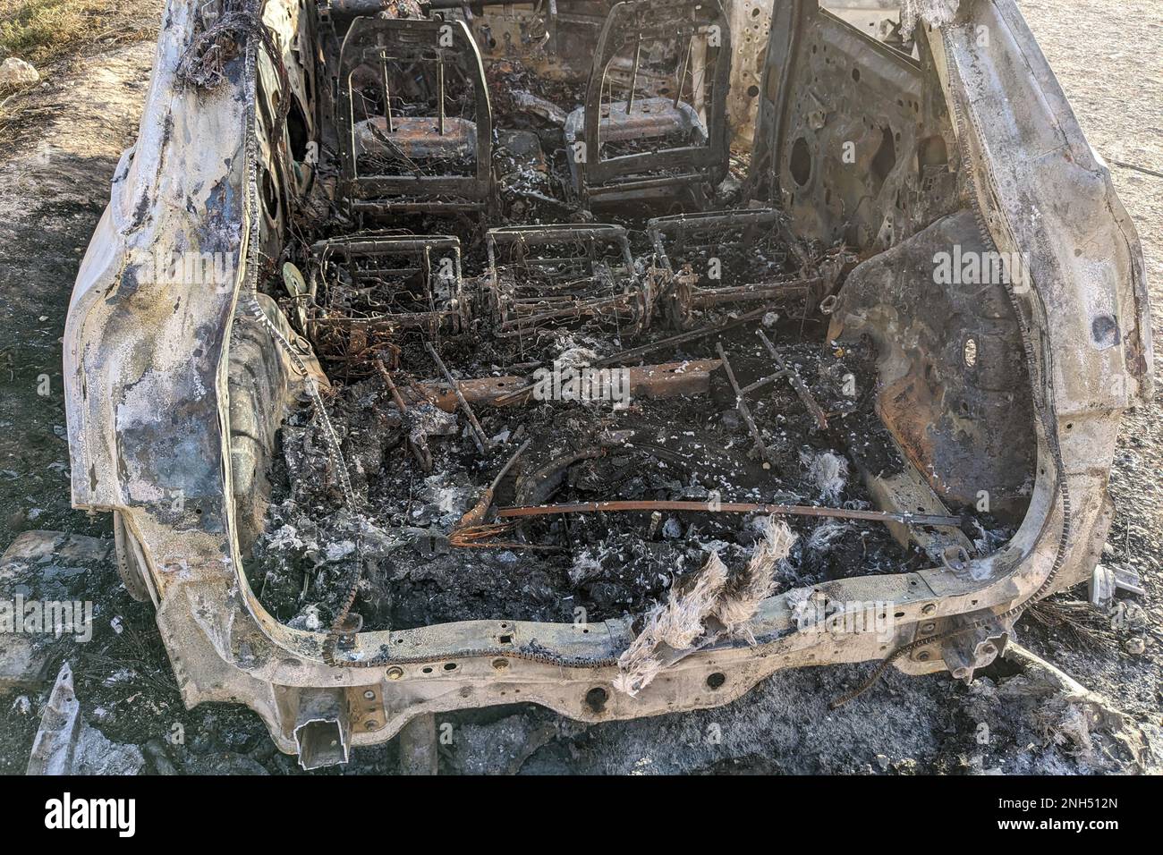 Car after the fire. Iron parts of burnt out car. Completely burnt ...