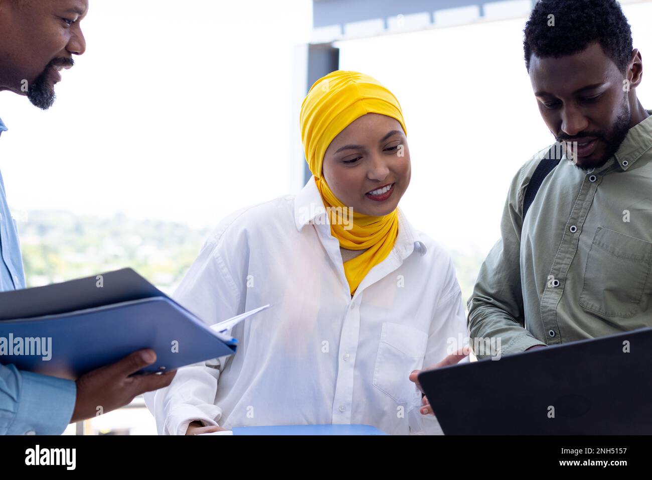 Diverse business people discussing documents hi-res stock photography ...