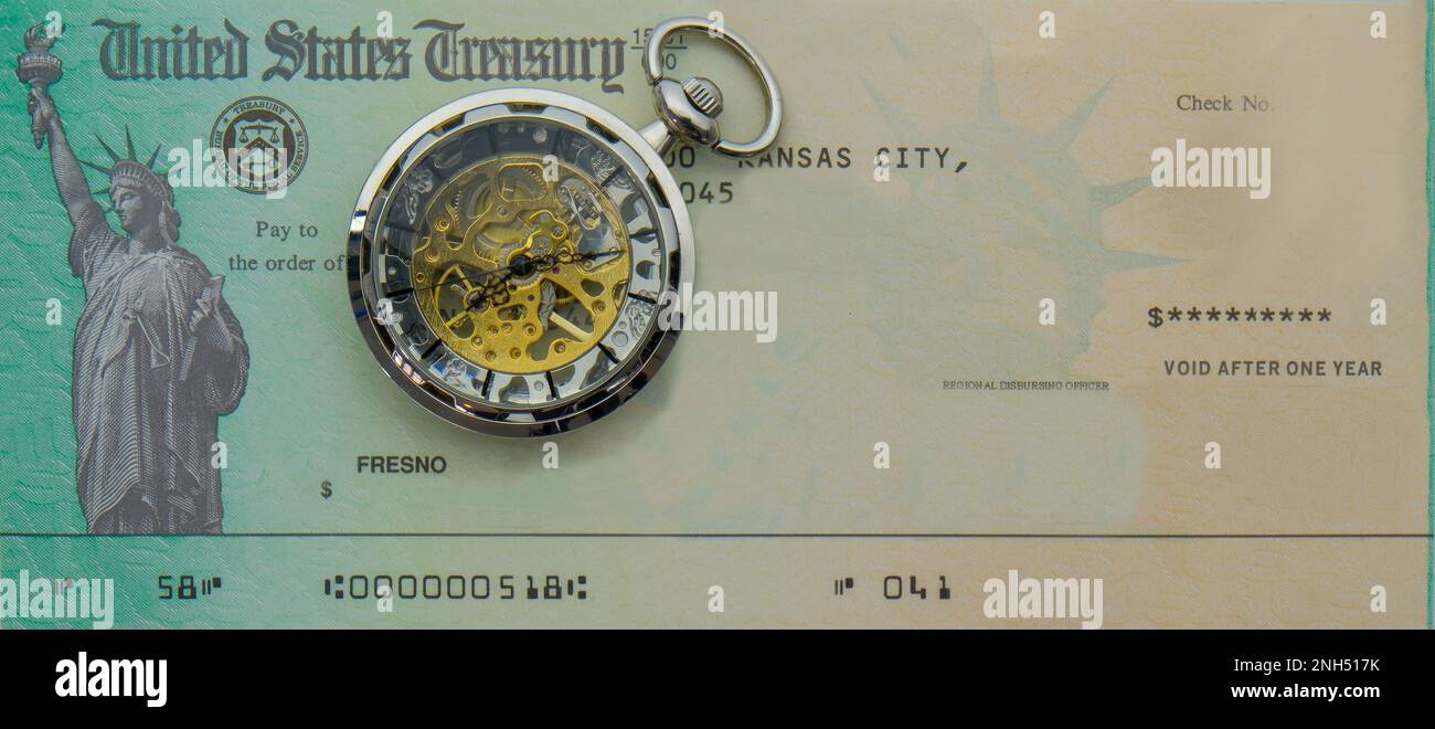 Photo of blank US Treasury check mock up with a modern pocket watch on ...