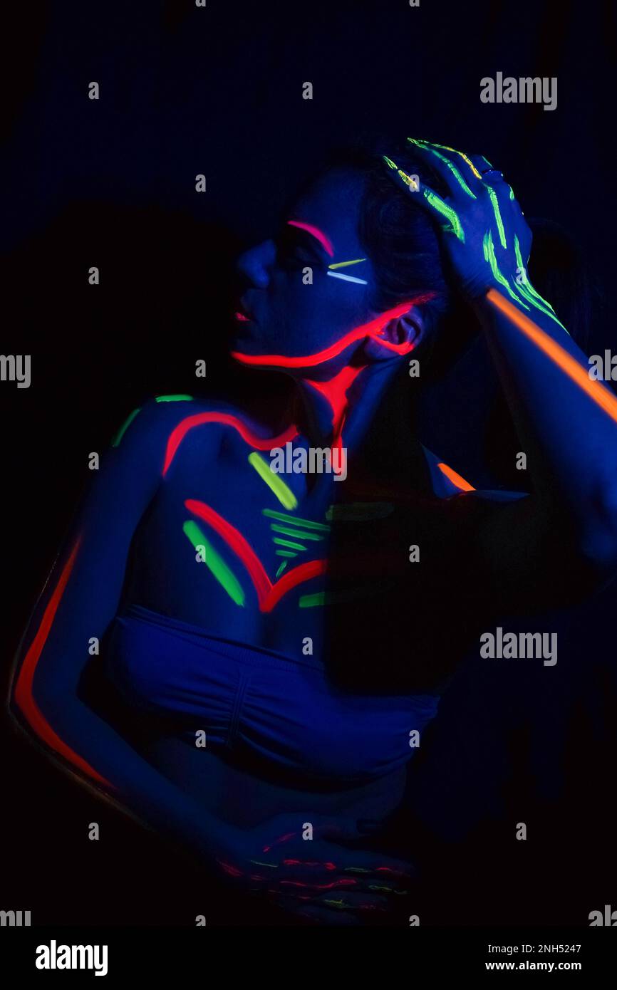 Portrait of a beautiful woman with blue sequins on her face. Girl with ...