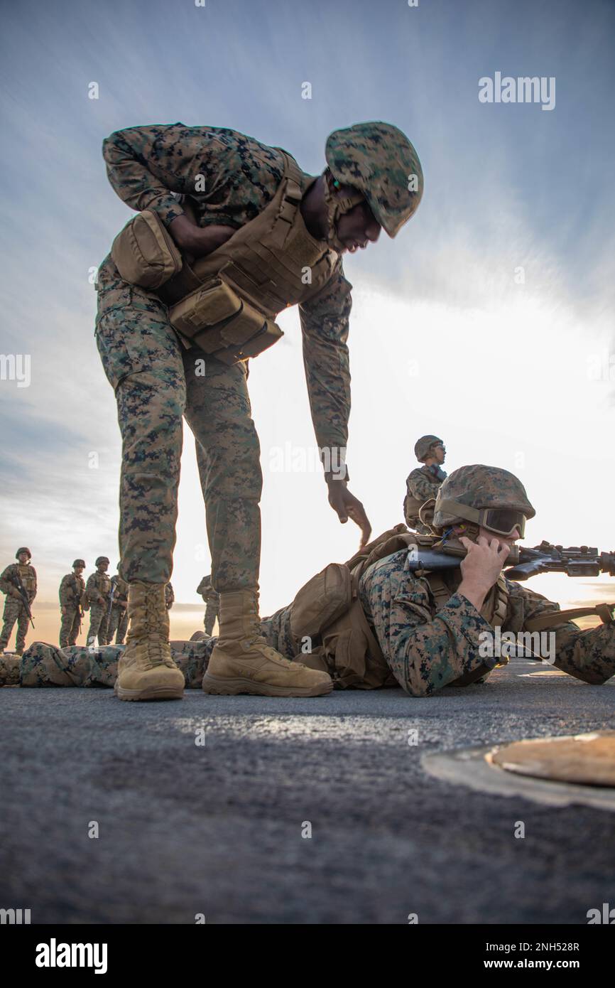 A U.S. Marine with Combat Logistics Battalion 22 checks an M16A4 ...