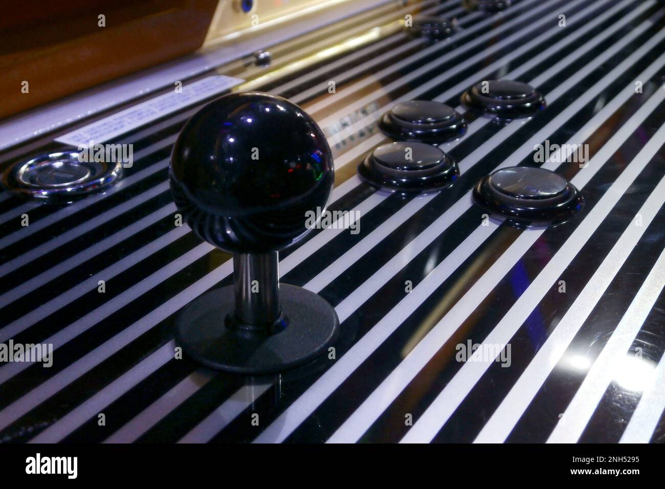 Close-up on a joystick and pushing buttons of an video arcade Stock ...