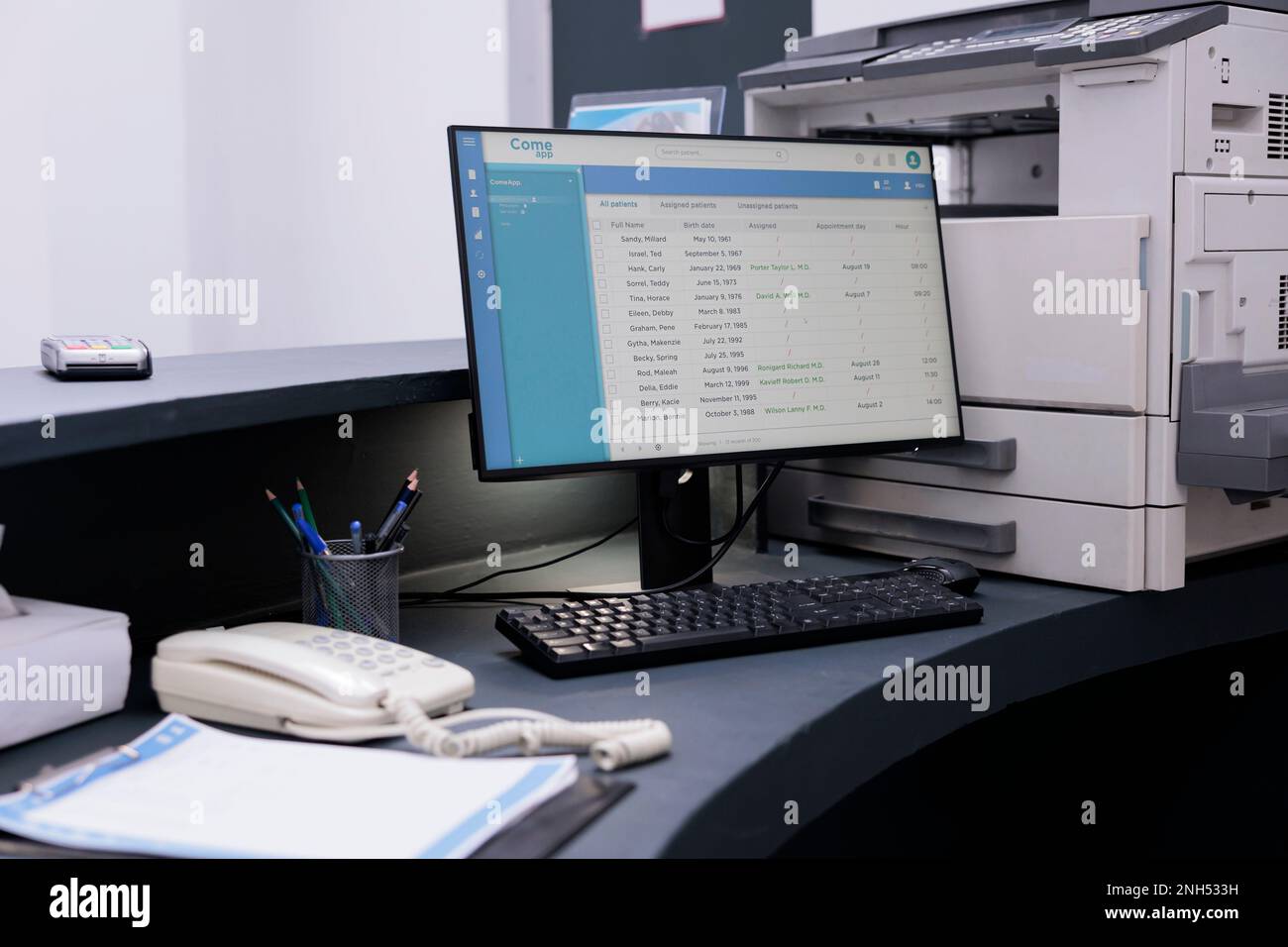 Empty health center registration counter with medical appointments on ...
