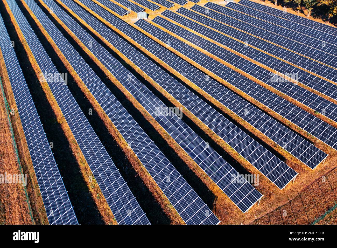 solar power station on a field with scorched grass in the foreground ...