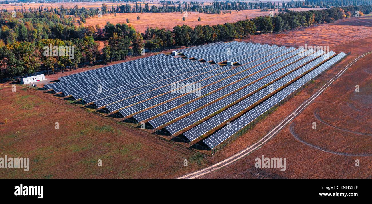 solar power station on a field with scorched grass in the foreground ...