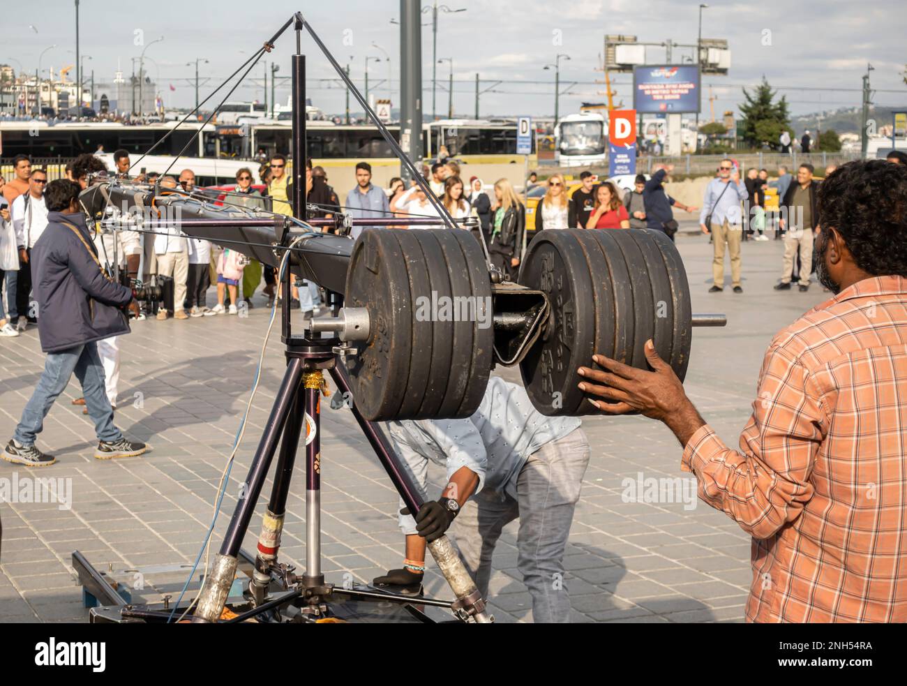Filming in Istanbul Turkey. Big crew in white clothing on the fim set ...