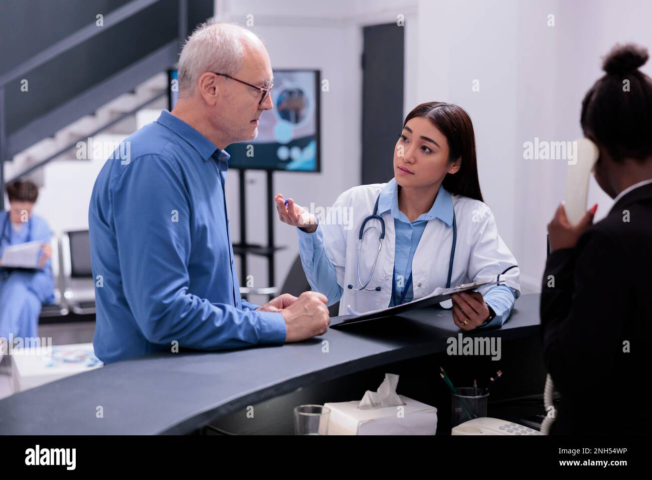 Hospital reception counter computer showing hi-res stock photography ...