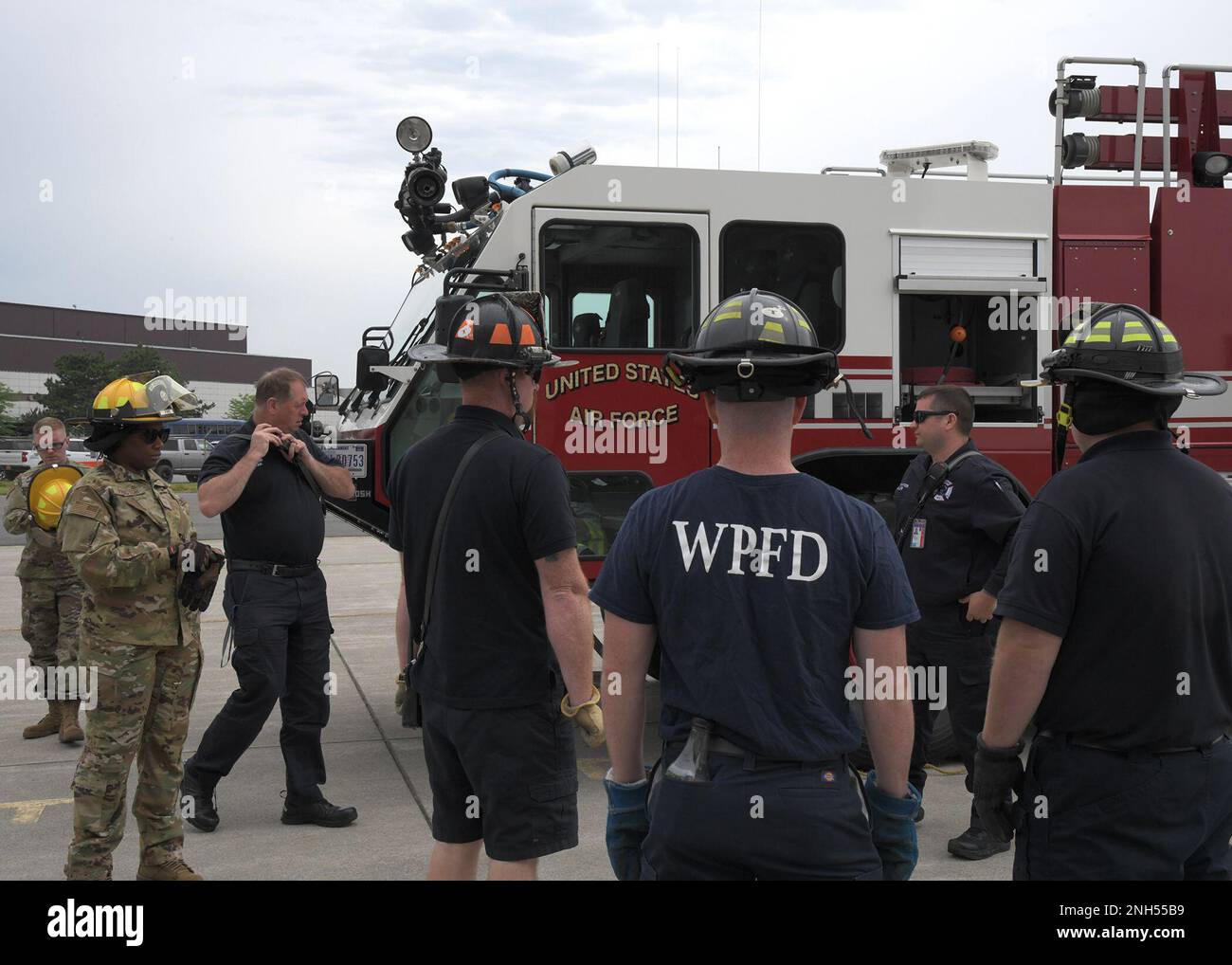Airmen from the 105th Airlift Wing Fire Department and firefighters ...