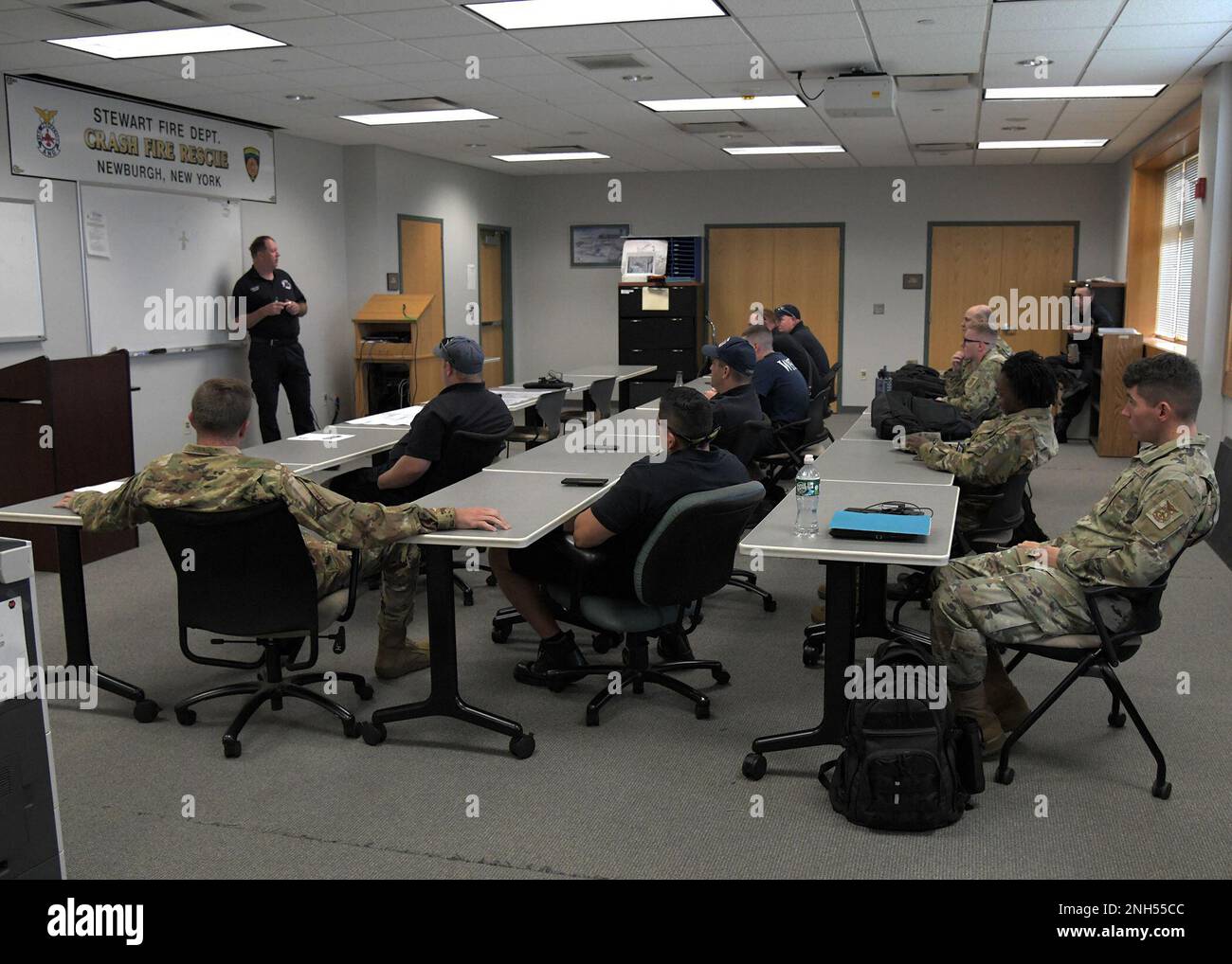 Fire Capt. Dan Lucak, station captain of Group 1, briefs airmen from ...