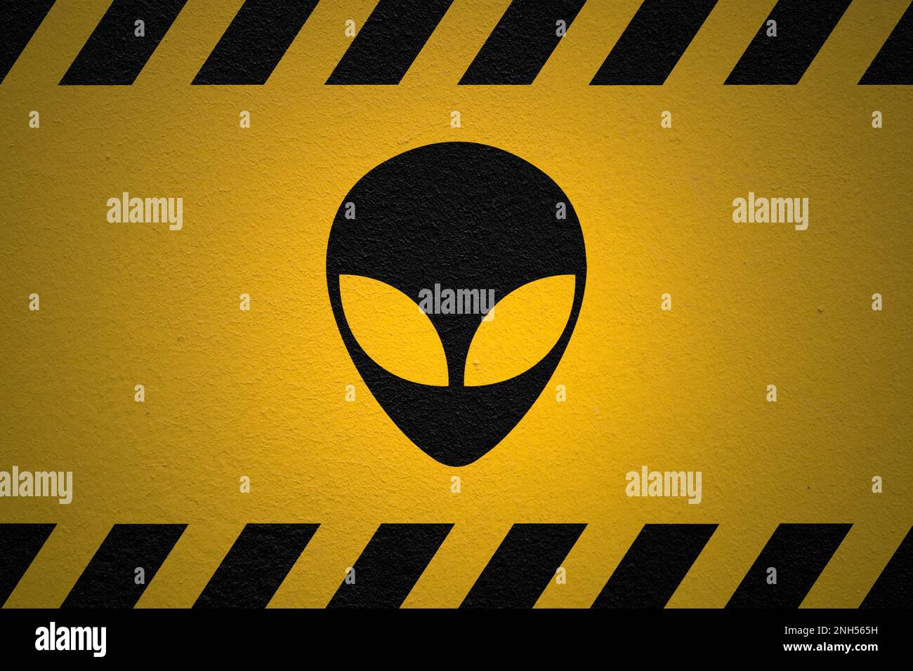 Black striped yellow background with an Alien warning sign and a light ...