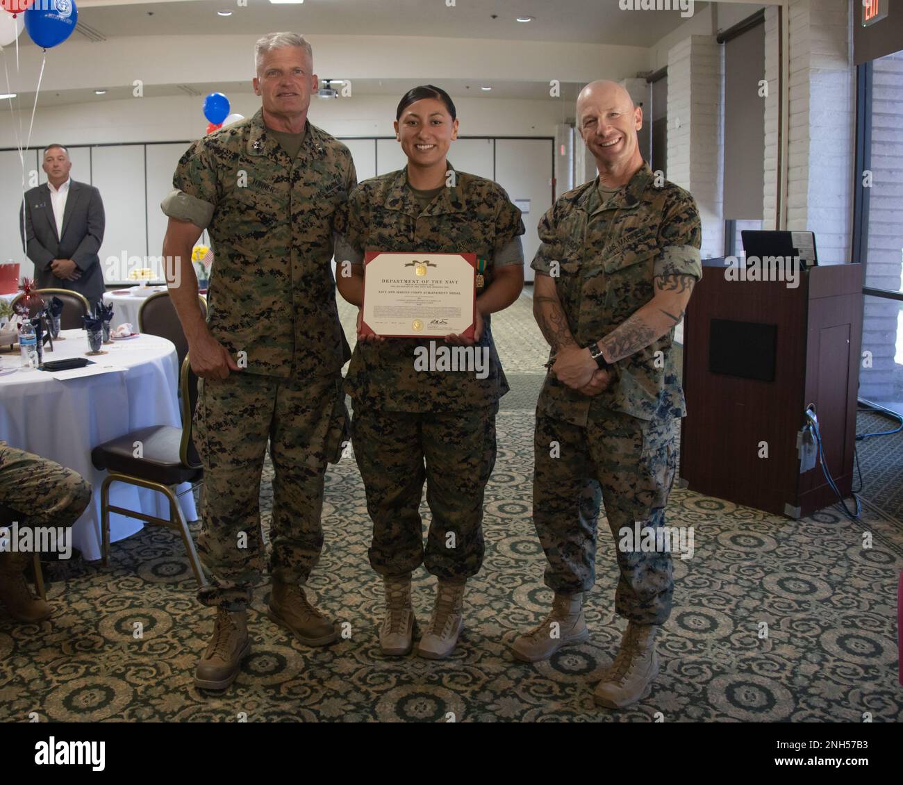 U.S. Marine Corps GySgt. Wendolyn Rebollar (center), an administrative ...