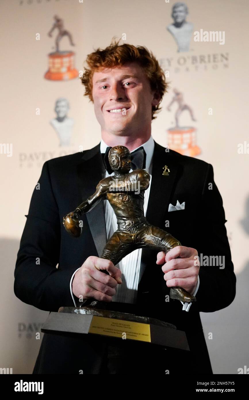 TCU quarterback Max Duggan smiles for photos with the Davey O'Brien Award at an NCAA college ...