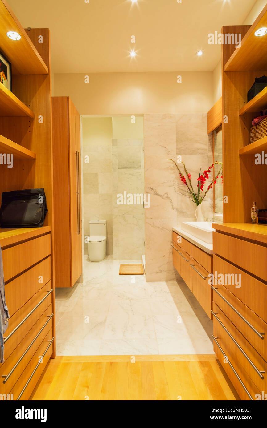Douglas fir wood cabinet with white marble countertop and rectangular ...