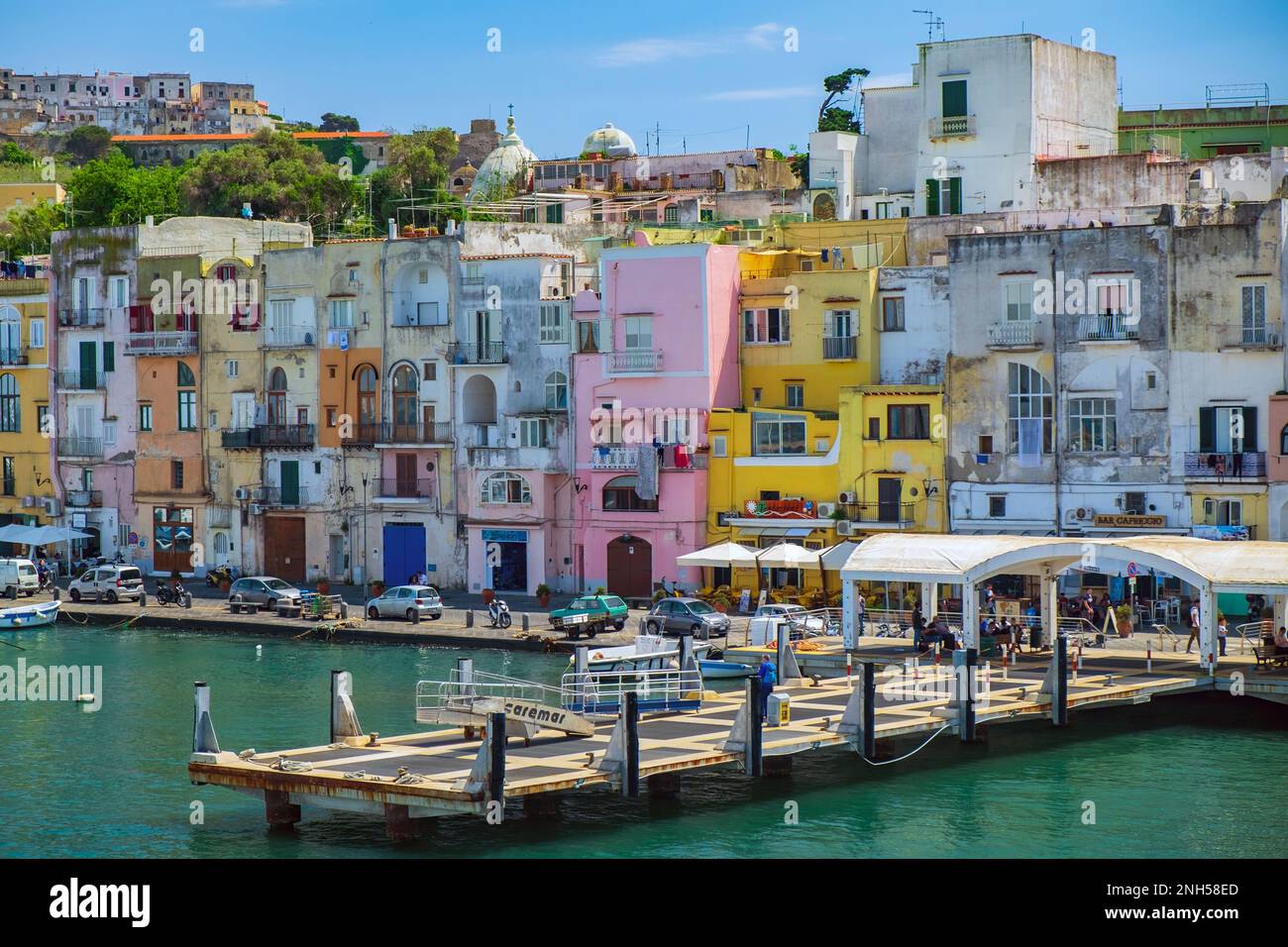 View of the Port of Corricella with lots of colorful houses on a sunny ...
