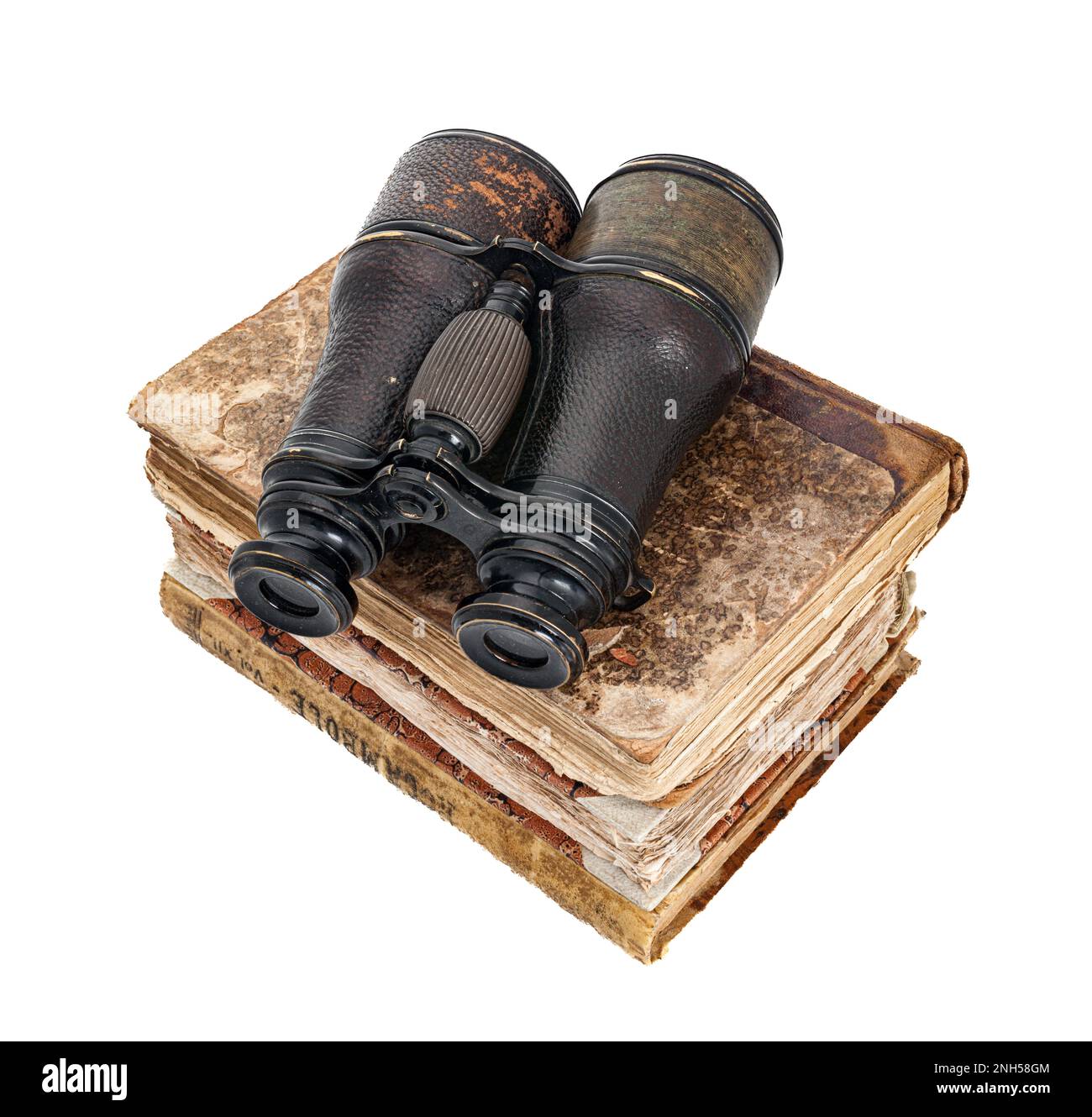 Stacks of very old paper books with weathered yellowed leather covers ...