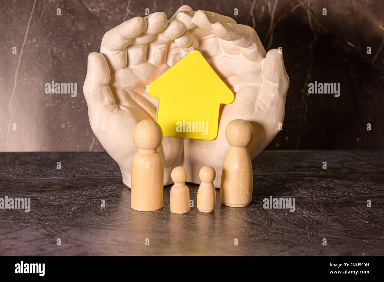 Small wooden figures of family members. Family relationship symbol ...